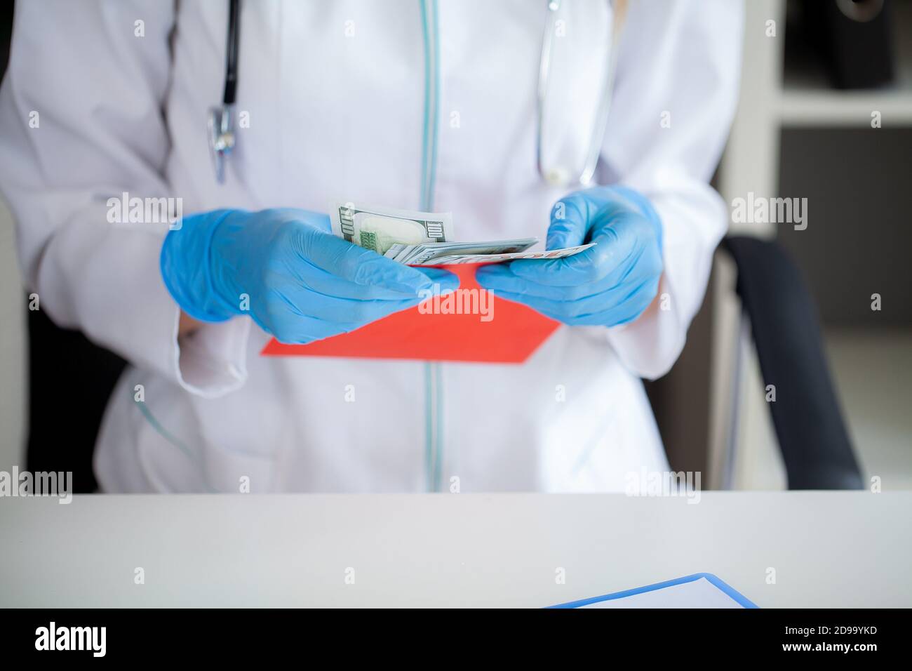 Doctor money envelope hi-res stock photography and images - Alamy