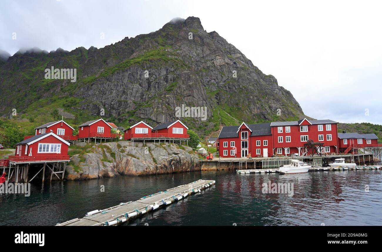 Traditional red rorbu houses, fishing boats in Å village, Lofoten ...