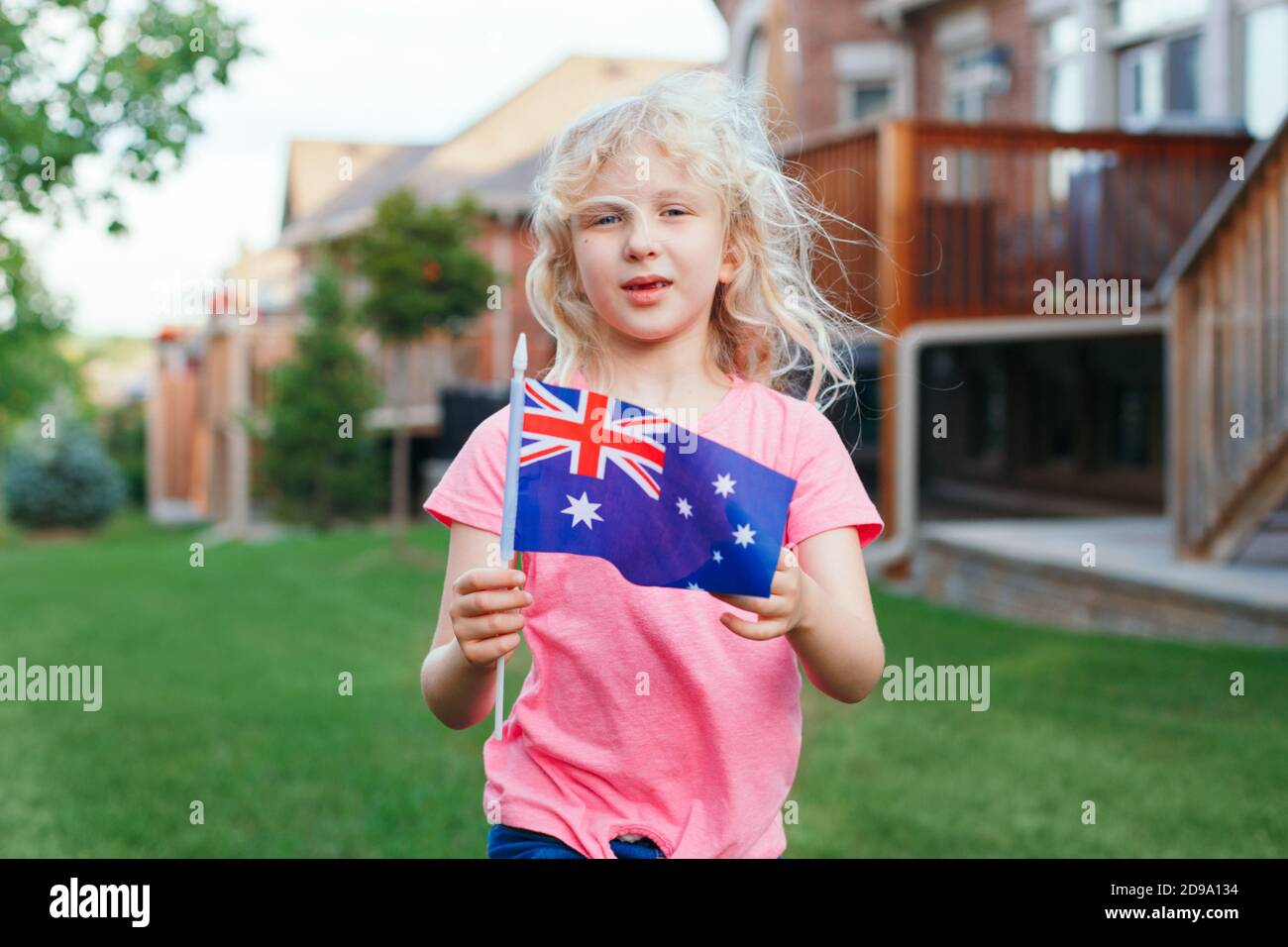 Adorable cute happy Caucasian girl holding Australian flag. Smiling ...