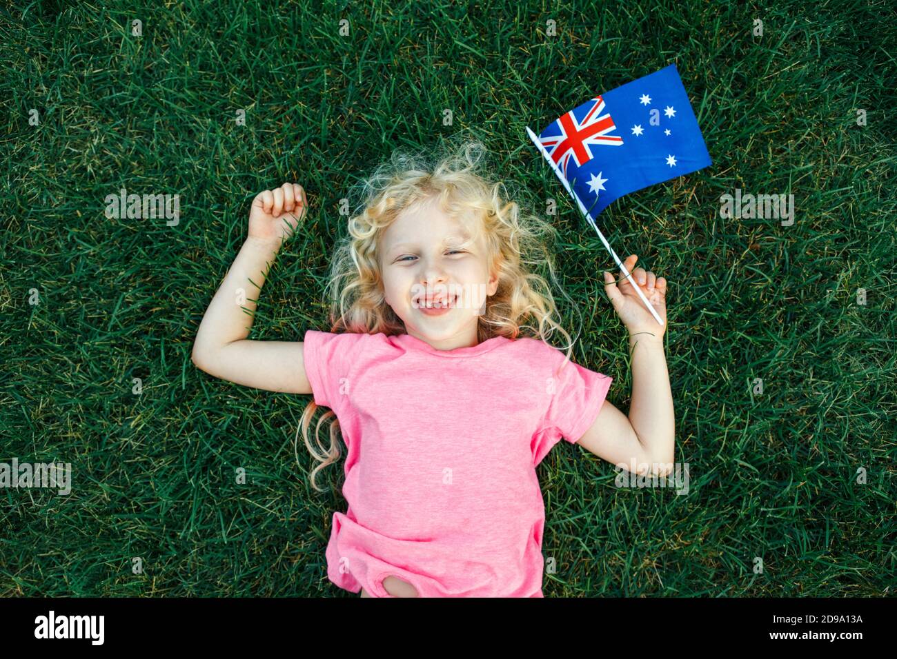 Adorable cute happy Caucasian girl holding Australian flag. Smiling ...