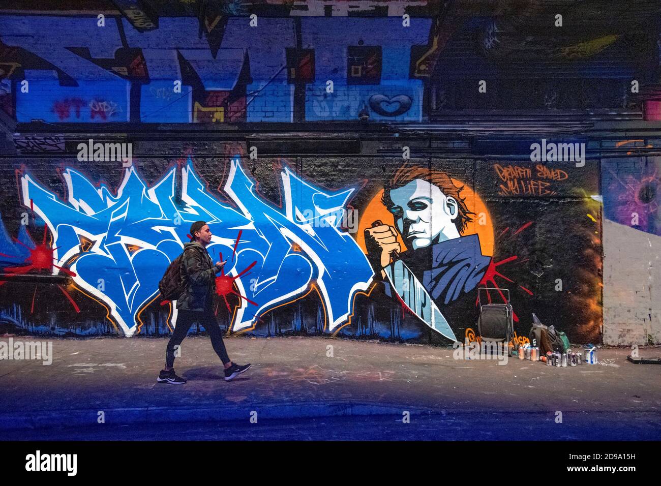 A man walks past Graffiti of a Halloween character Michael Myers at the ...