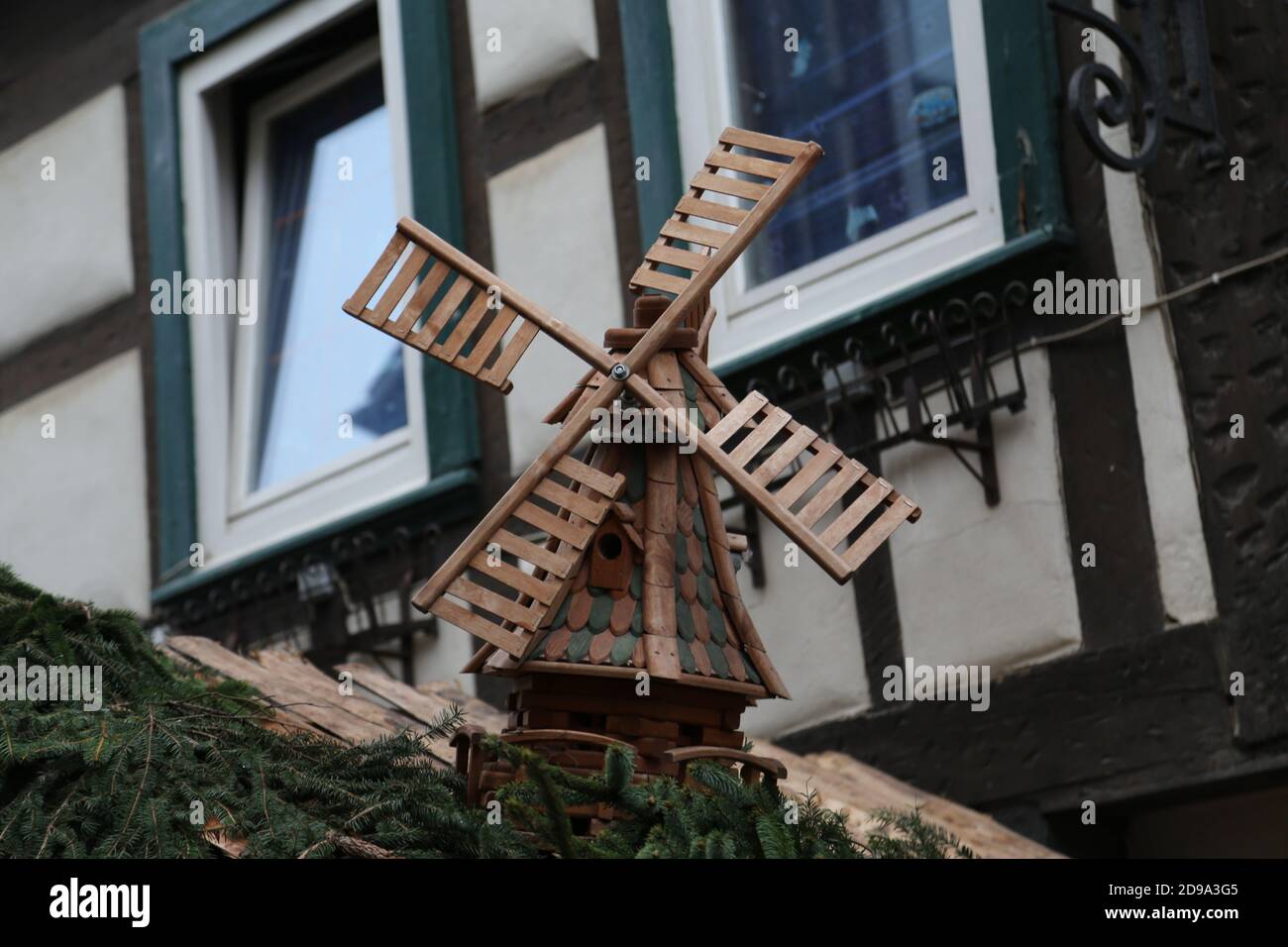 Closeup of a wooden decorative windmill on display at a Christmas scene ...