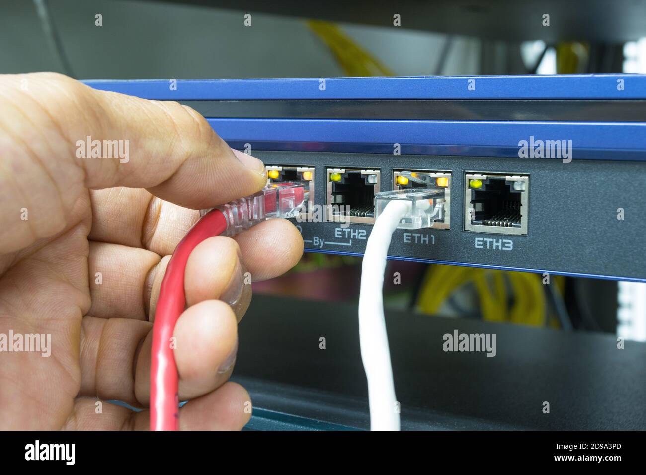 Hand of man holding The network cables to connect Lan port, concept ...