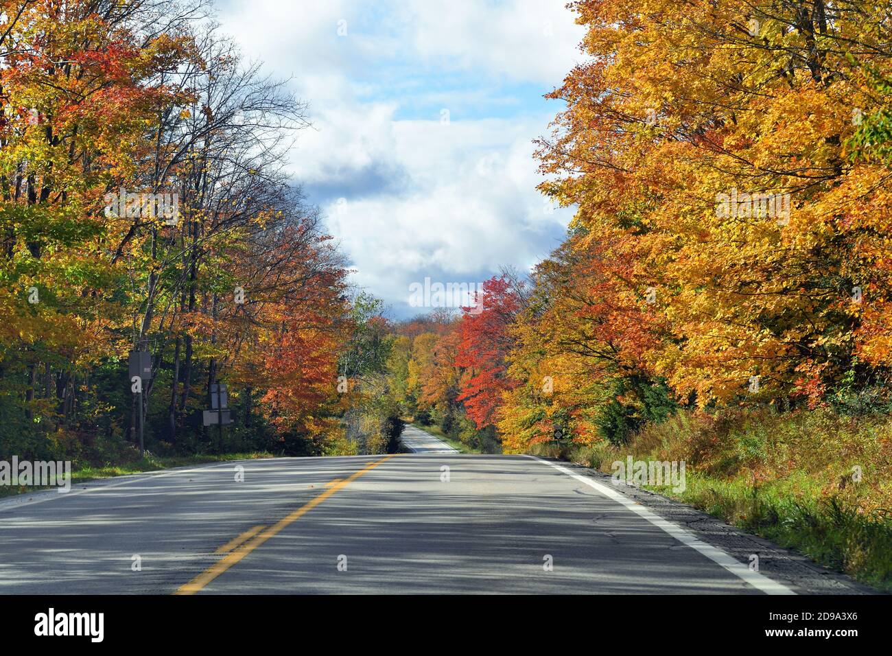 Paradise, Michigan, USA. Fall descends on a stretch of empty highway in ...