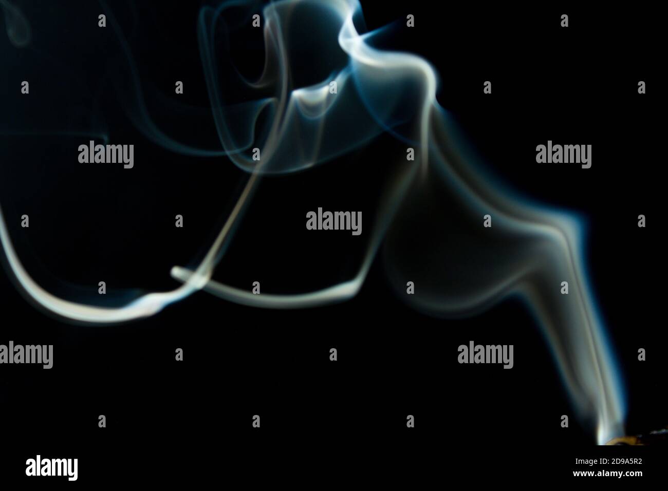 Abstract flowing Blue wispy smoke on dark background Stock Photo - Alamy
