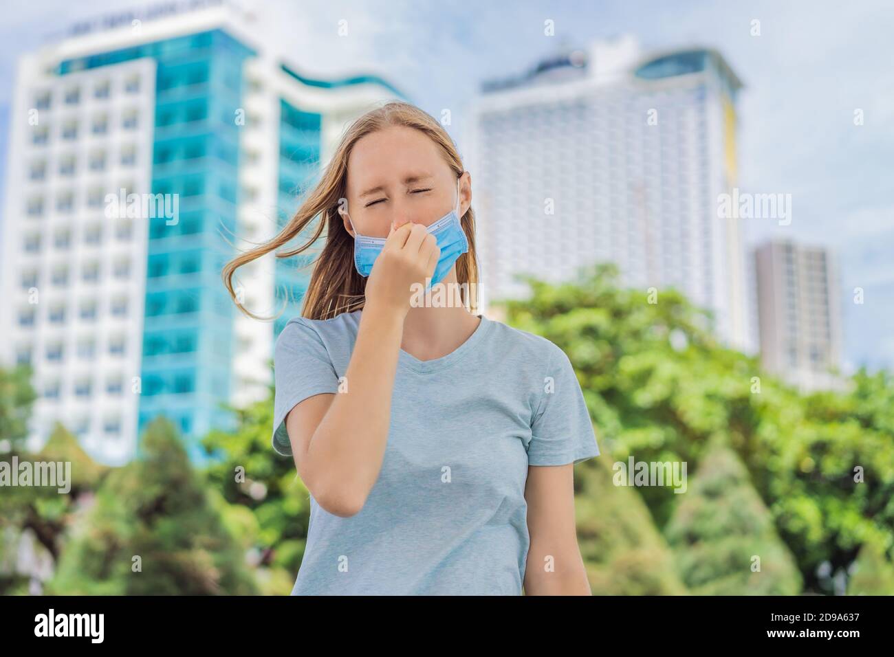 Improper wearing of mask concept. Woman scratching his nose under the ...