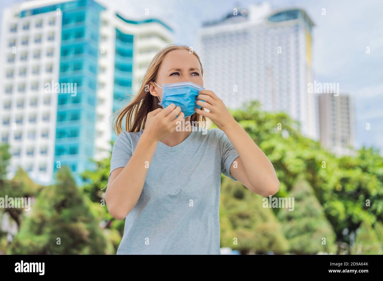 Improper wearing of mask concept. Woman scratching his nose under the ...