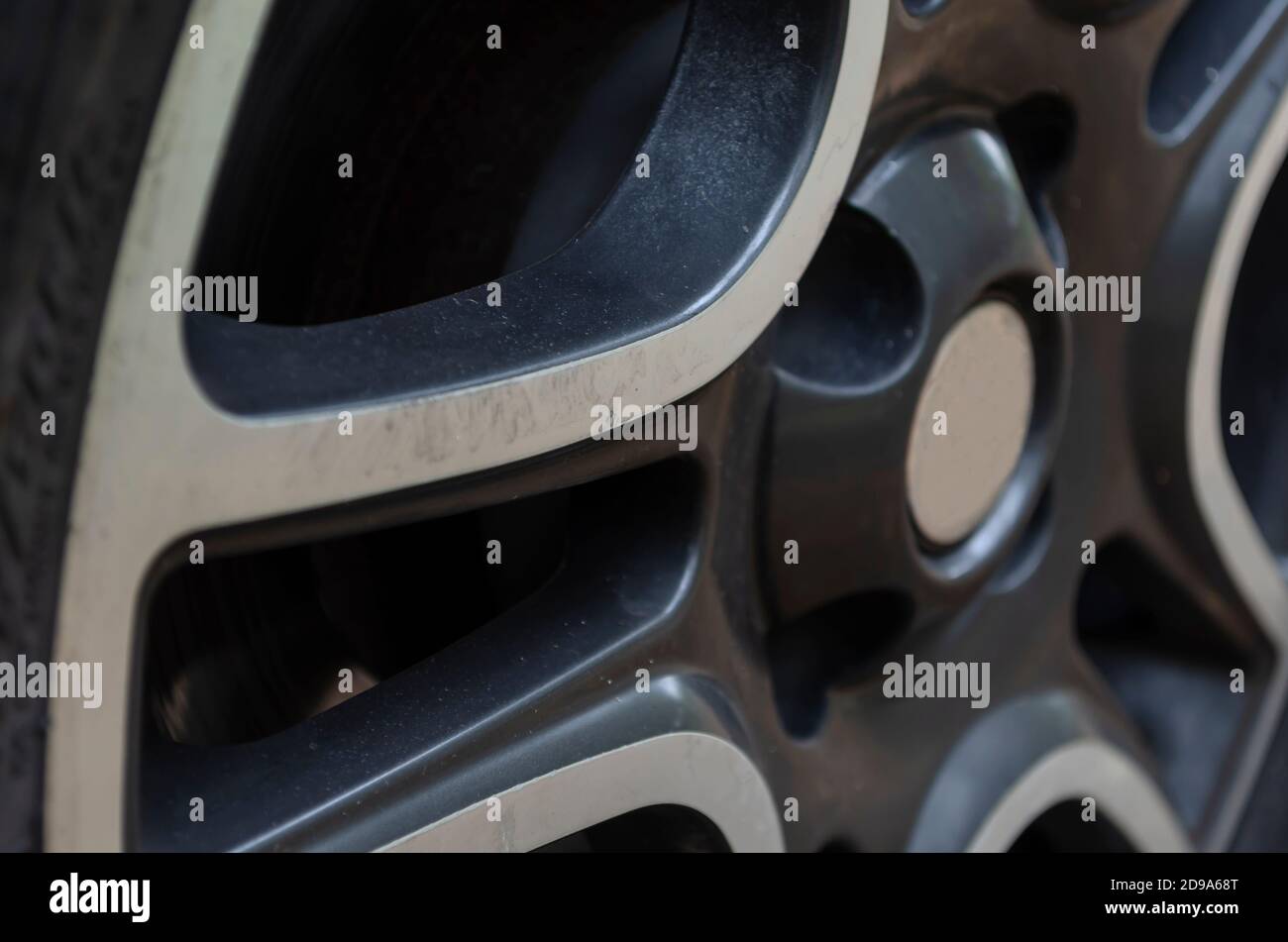 Wheel rim with scratches and dirt. Scratches and abrasions on the cast ...