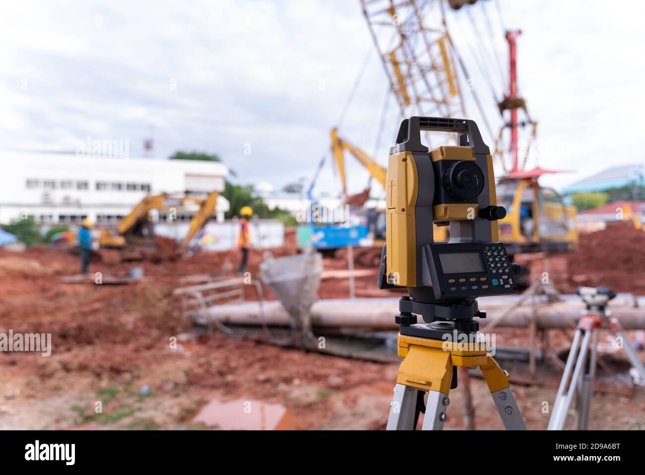 Theodolite equipment of Surveyor builder engineer during surveying work ...