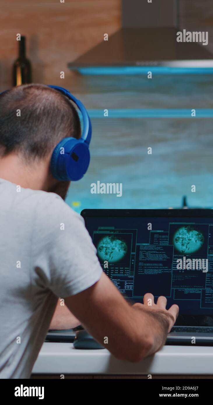 Remote man thief with headset stealing data from company hacking system ...