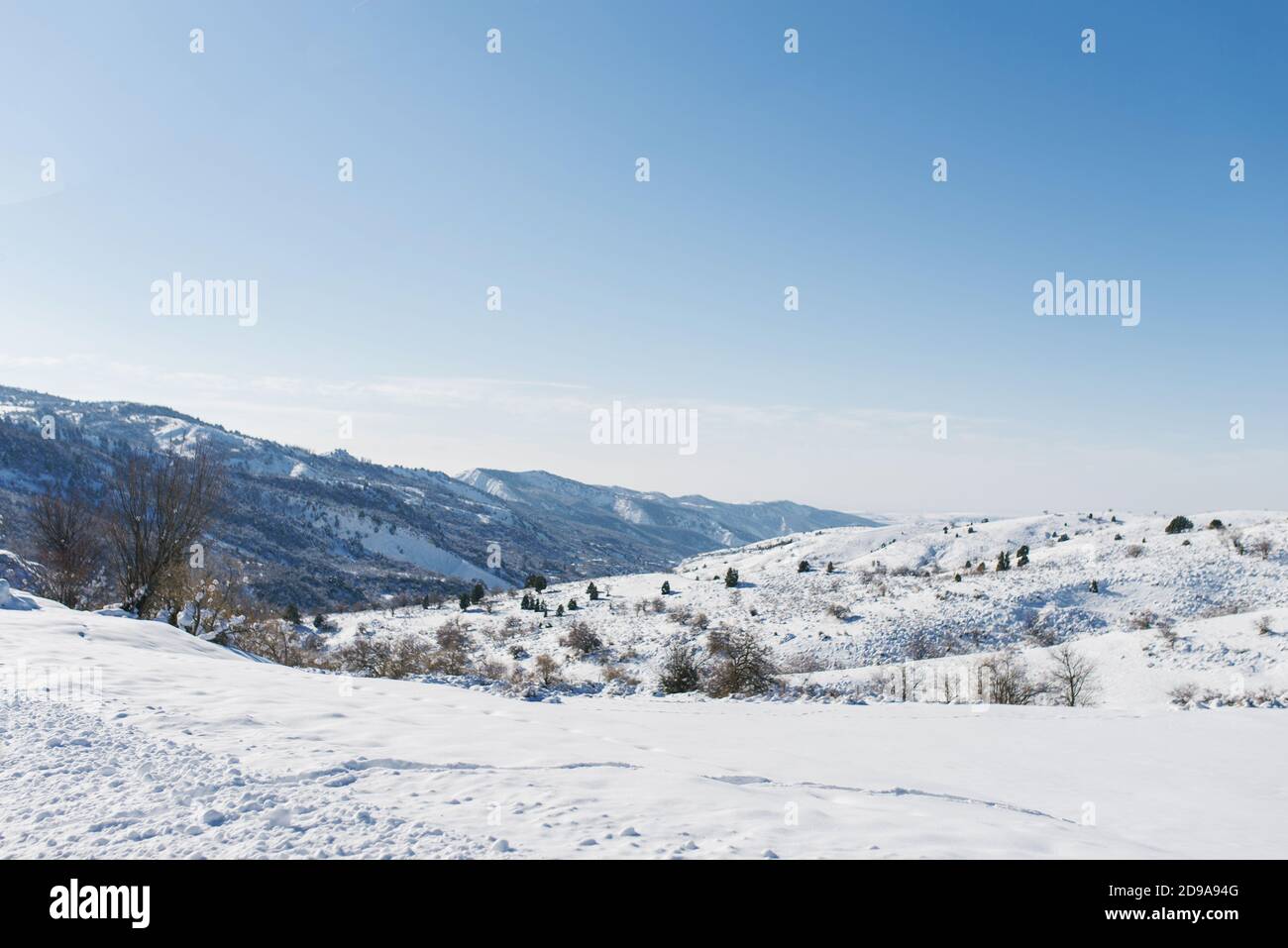 First snow in the mountains of Uzbekistan. Winter mountain landscape in ...