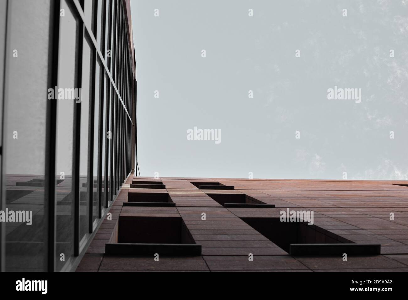 Low angle shot of a modern building architectural exterior walls with ...