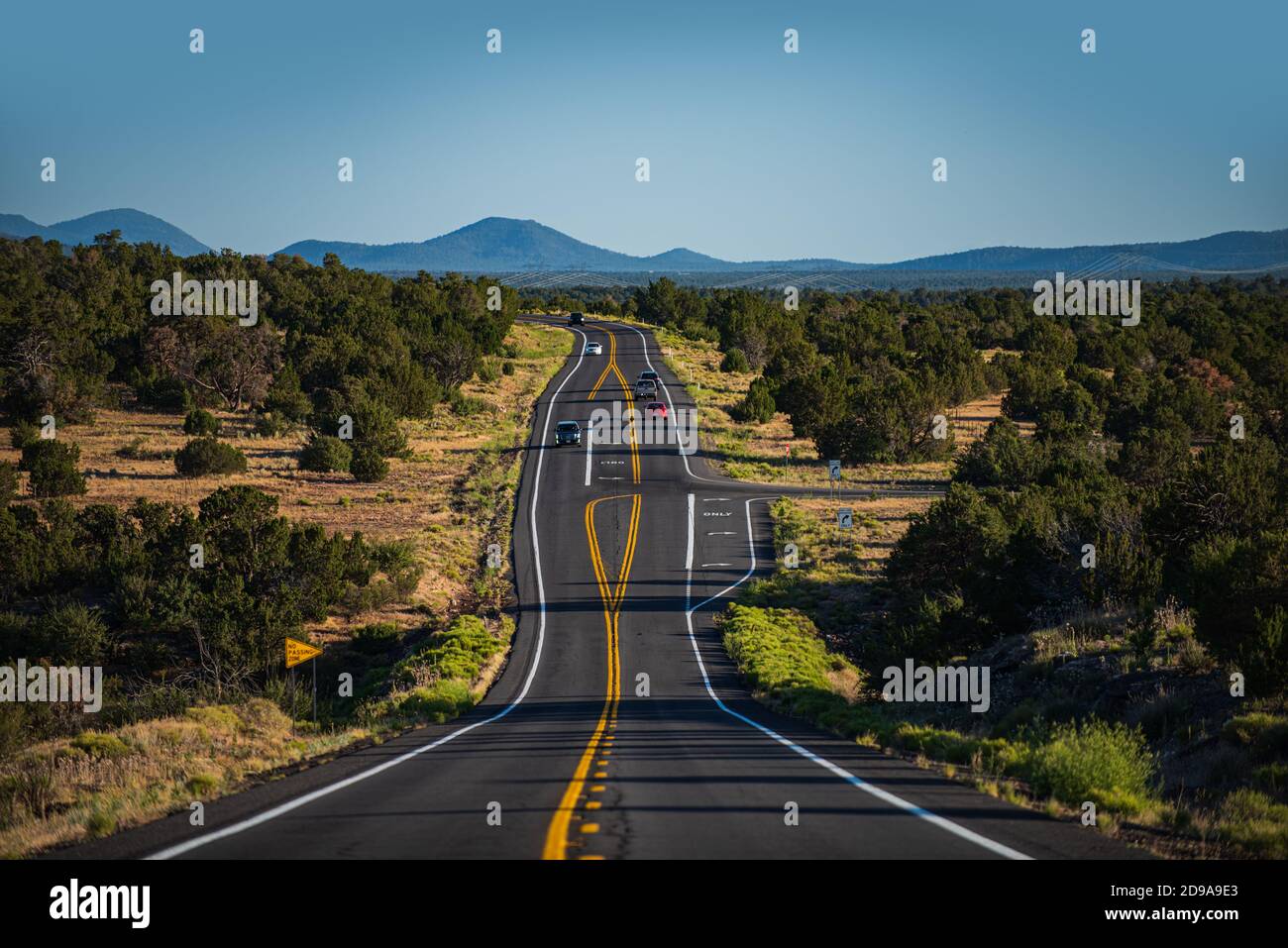 Landscape scene and sunrise above road. Route through Stock Photo - Alamy