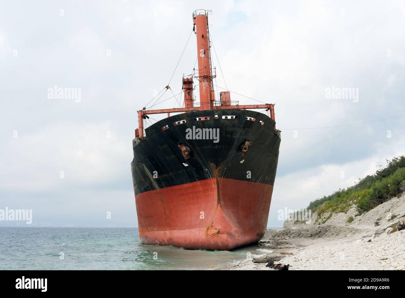 dry cargo ship ran aground near the shore. old abandoned ship standing ...