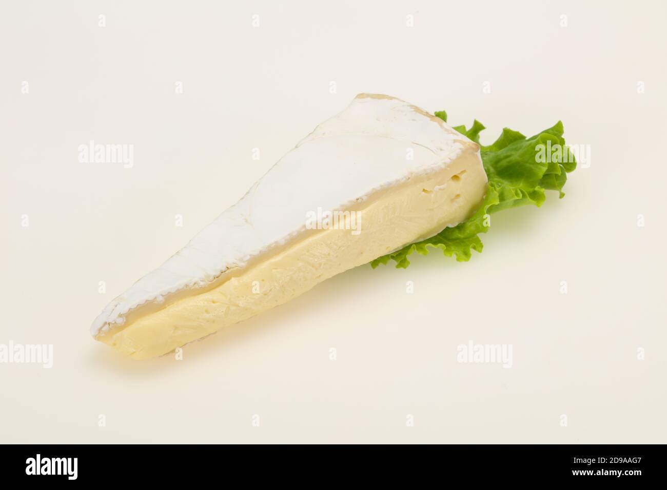 Brie cheese triangle served salad leaves Stock Photo - Alamy