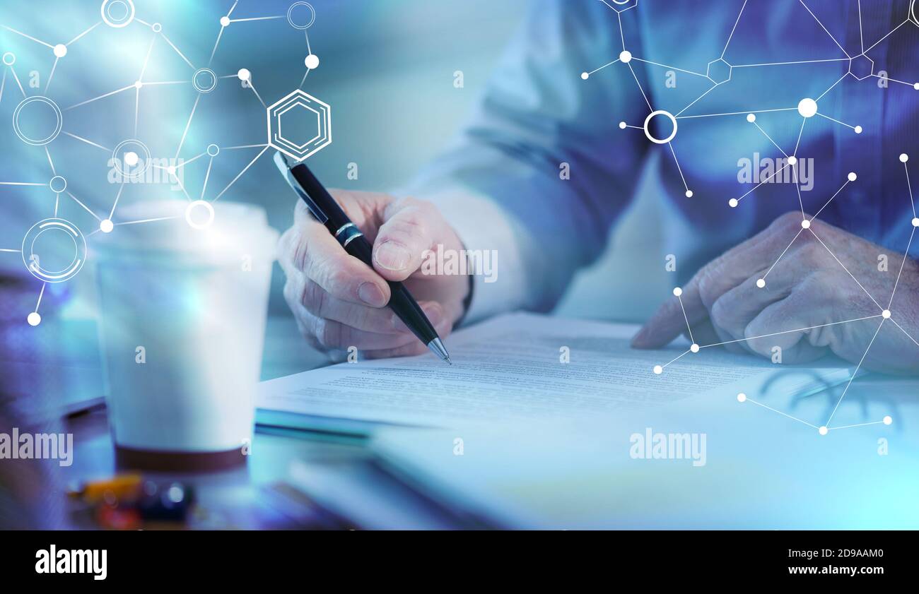 Businessman checking a document in office; light effect Stock Photo - Alamy