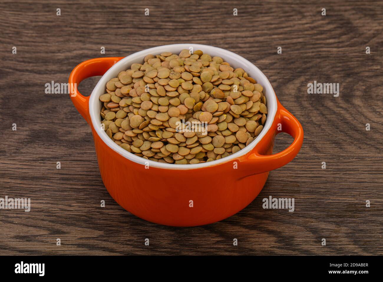 Vegan cuisine - Dry lentil heap isolated Stock Photo - Alamy