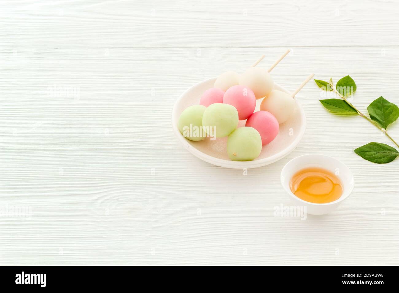 Japanese Dango dessert in pink, white and green colors, copy space ...