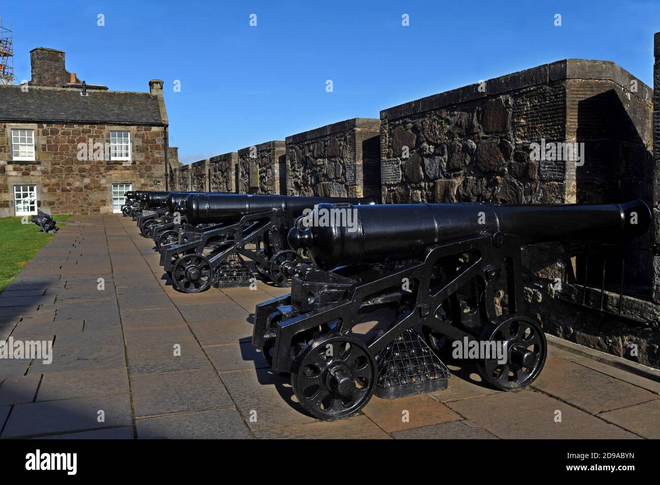A row of old cannon pointing out over the walls of historic Stirling ...