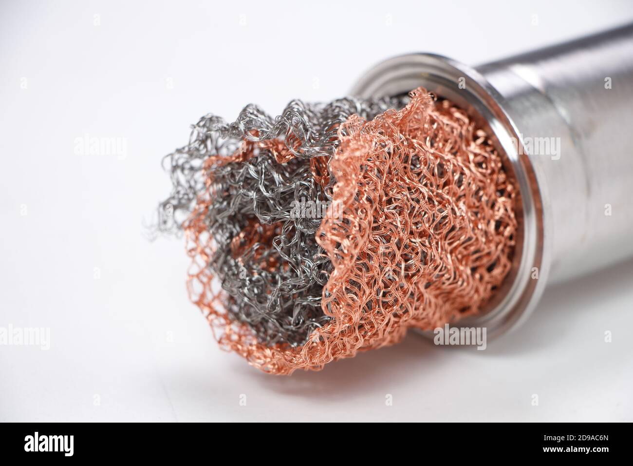 Shot of metal rolled grid filter in iron pipe Stock Photo - Alamy