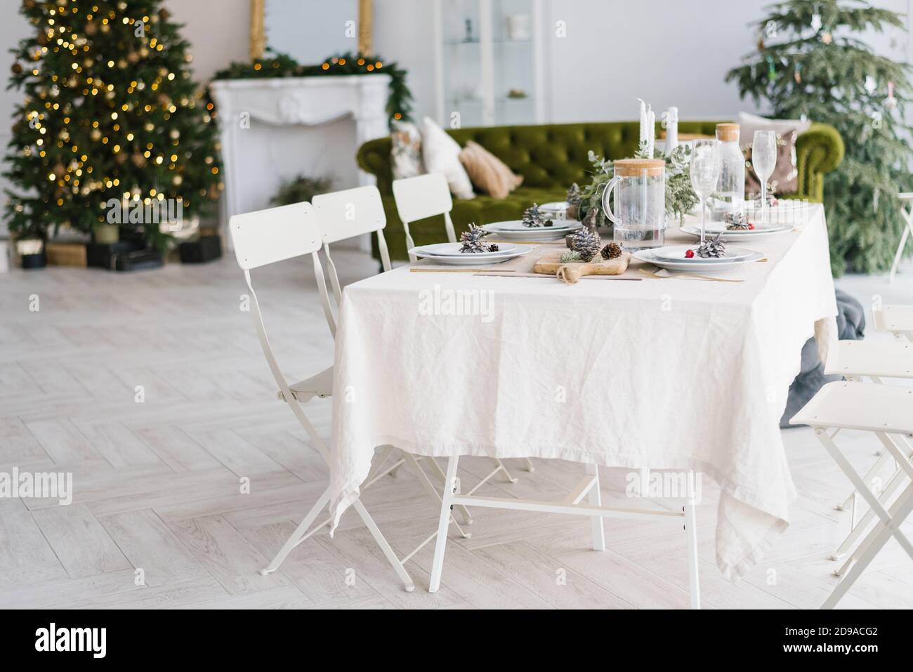 Christmas holiday beautifully set table in a spacious bright dining ...