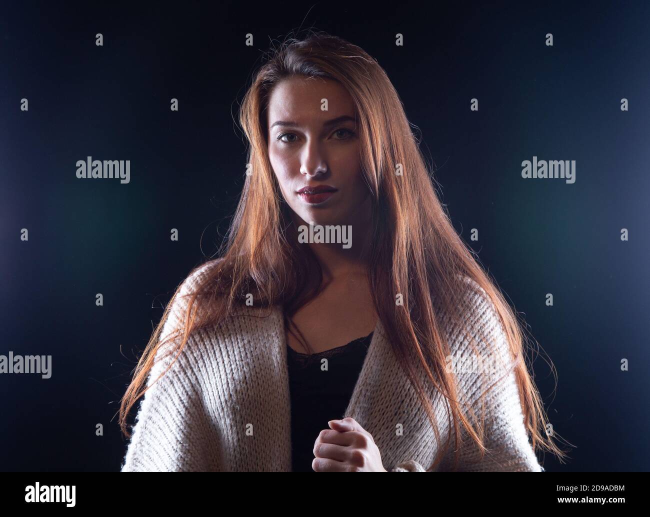 Image of young woman with long hair in knitted sweater Stock Photo - Alamy