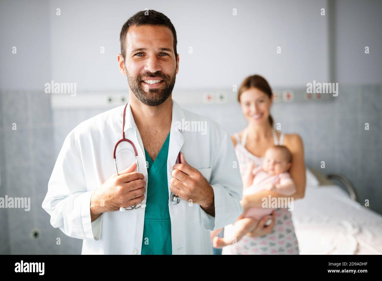 Doctor pediatrician with mother and baby child in clinic. Hospital ...