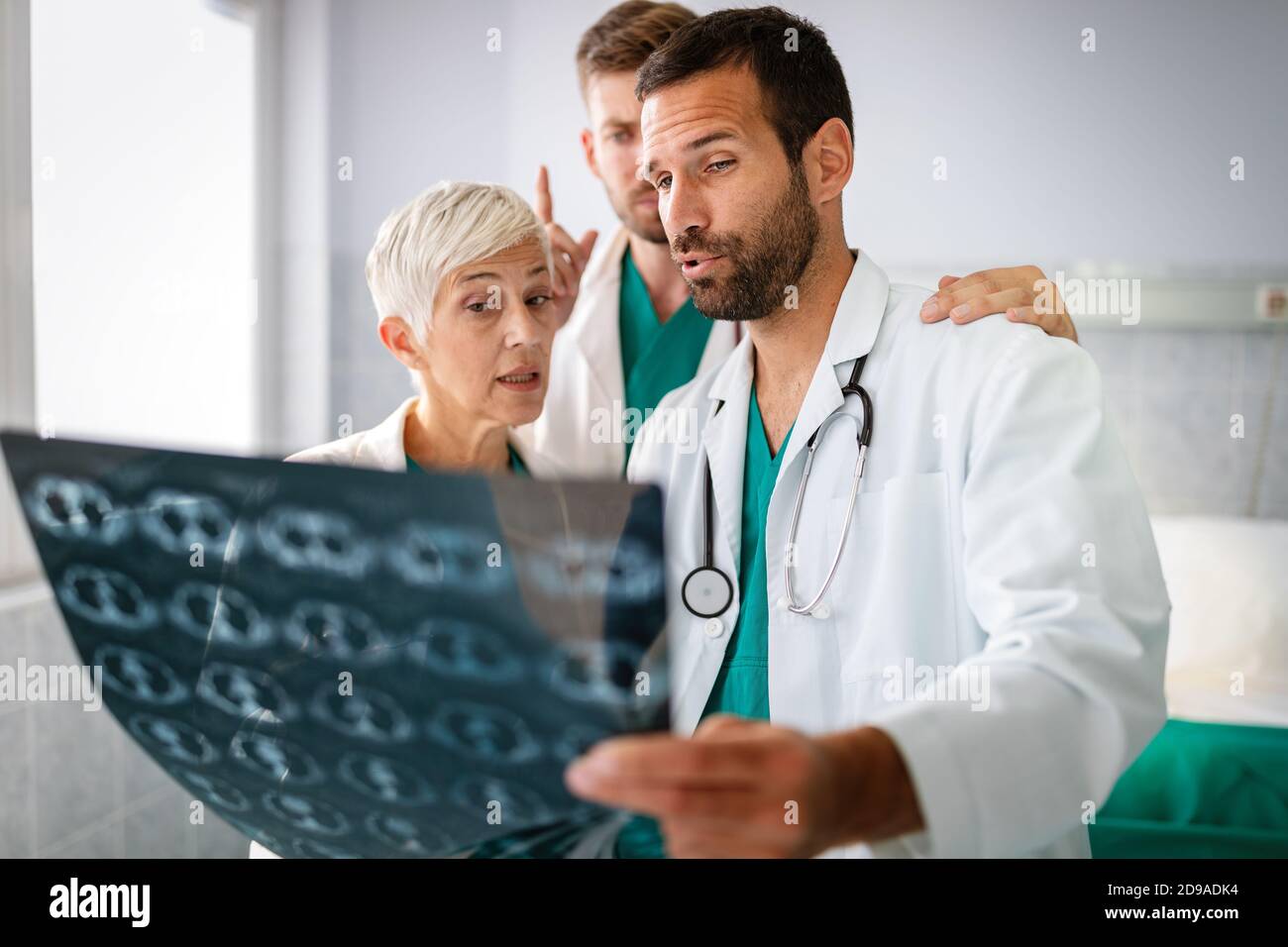 Group of doctors checking x-rays in a hospital Stock Photo - Alamy
