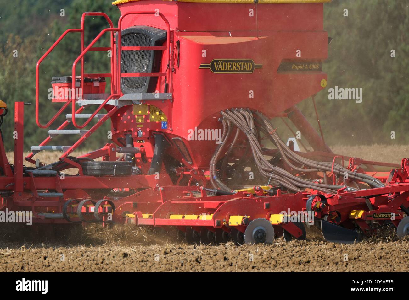 Modern high tech farm machinery in use preparing a field for crop ...