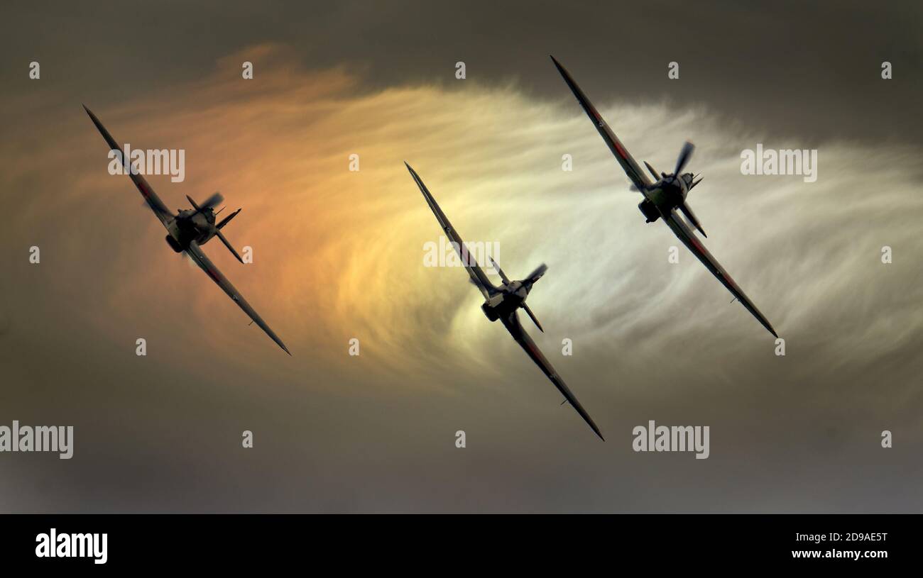 Hawker Hurricane and spitfire in action at an air ahgow. Sky added ...