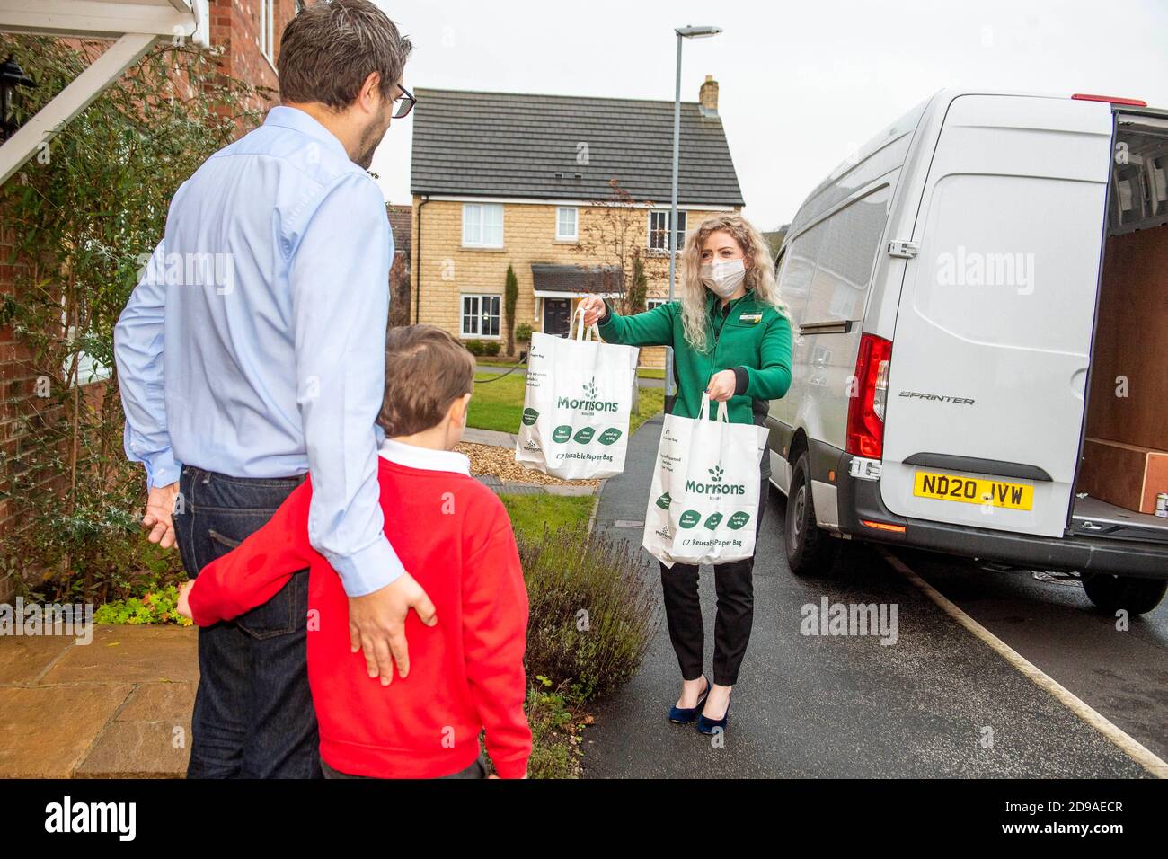 EDITORIAL USE ONLY Nicole Olive from Morrisons deliver food to David ...