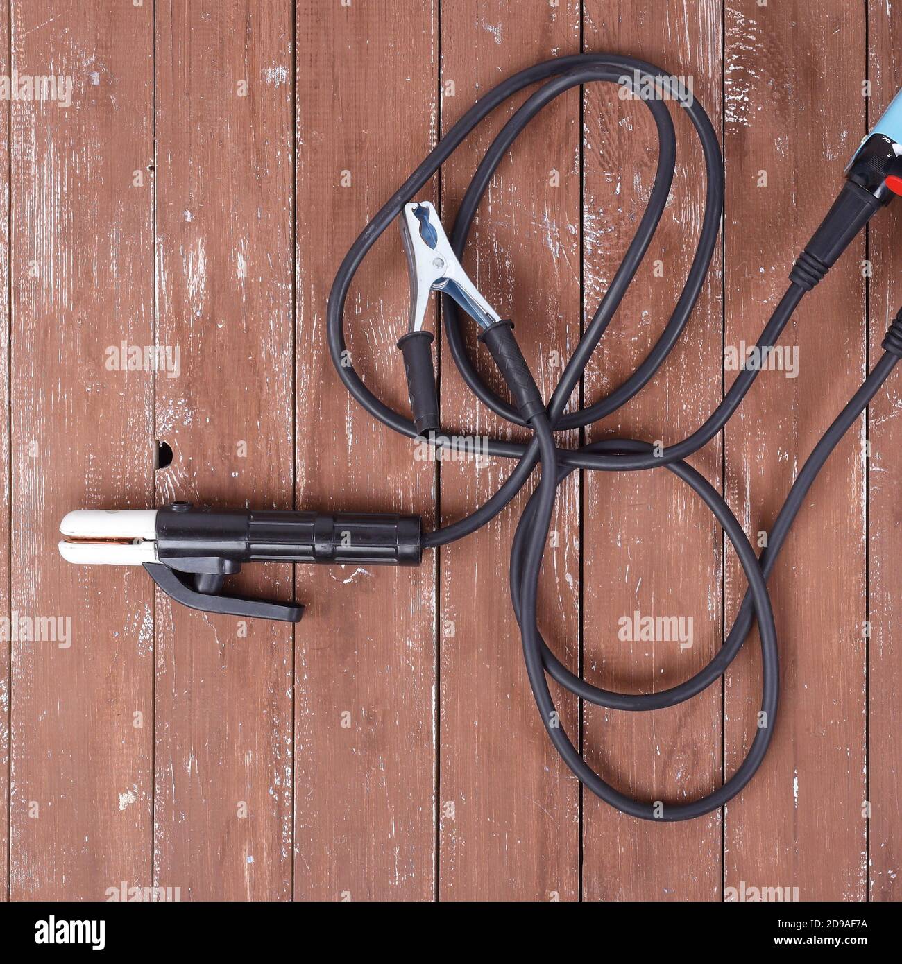 Industrial tool - Top view closeup fragment Welding machine on a wooden ...