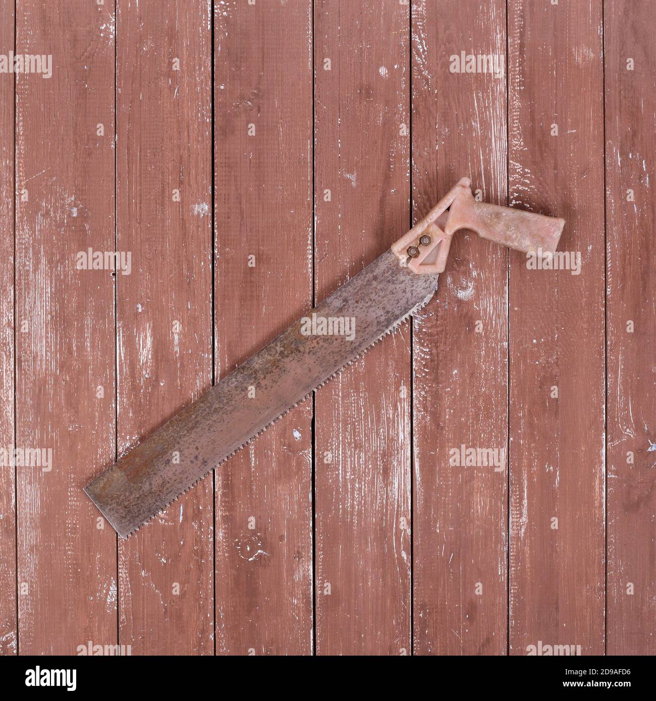 Tools Building and repair - Top view Old rusty hand saw on a wooden ...
