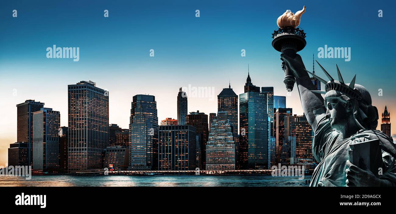 New York City skyline panorama with Statue of Liberty in evening time ...