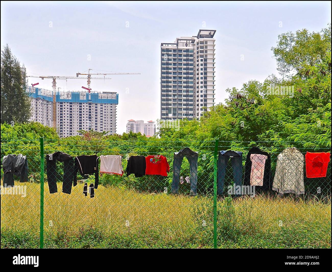 Laundry drying on a wire fence Stock Photo - Alamy