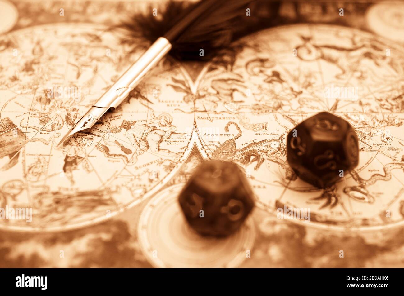 antique astrology chart with zodiac signs and dice with a quill pen ...