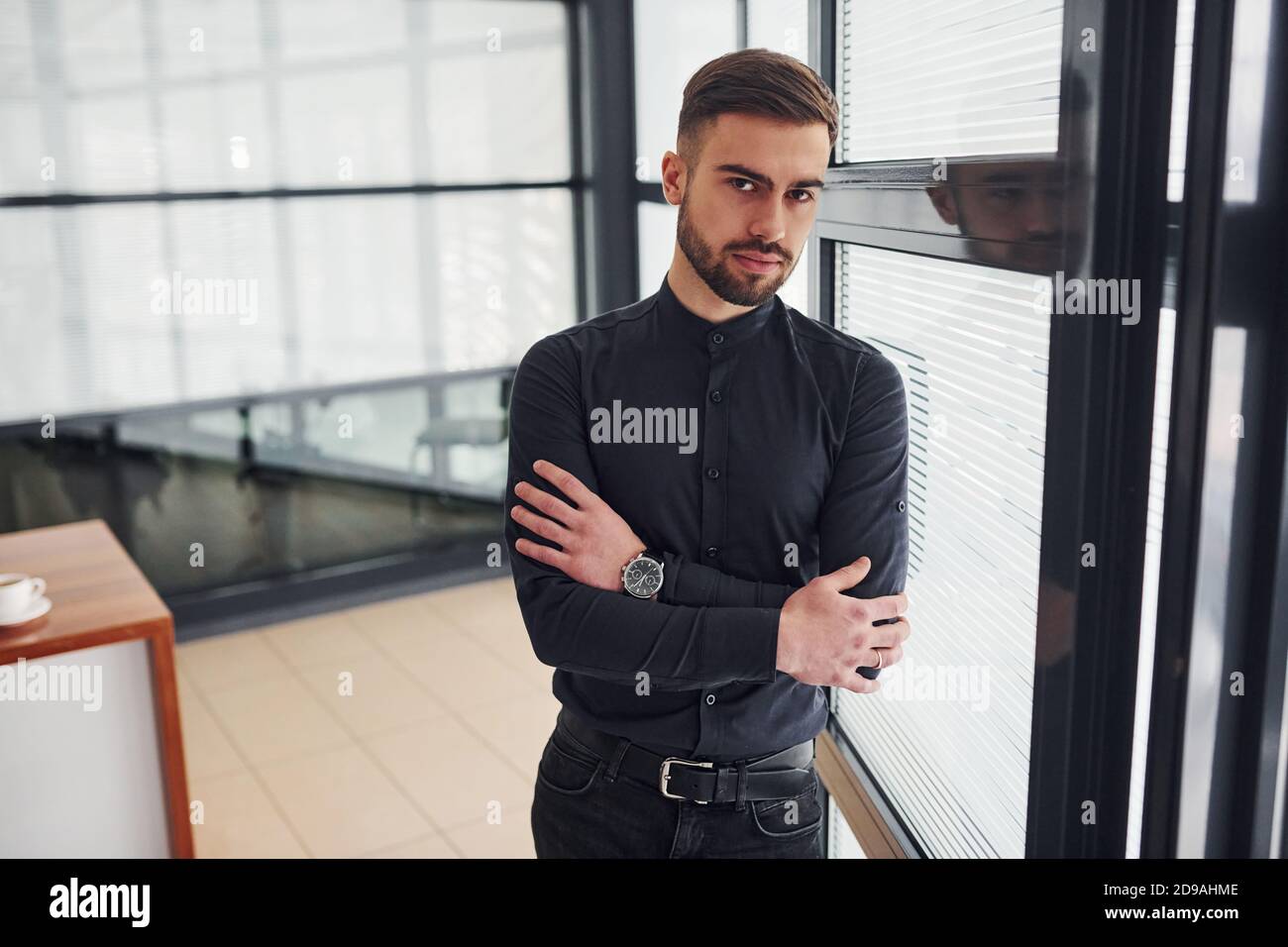 Office worker in formal clothes standing indoors at daytime Stock Photo ...