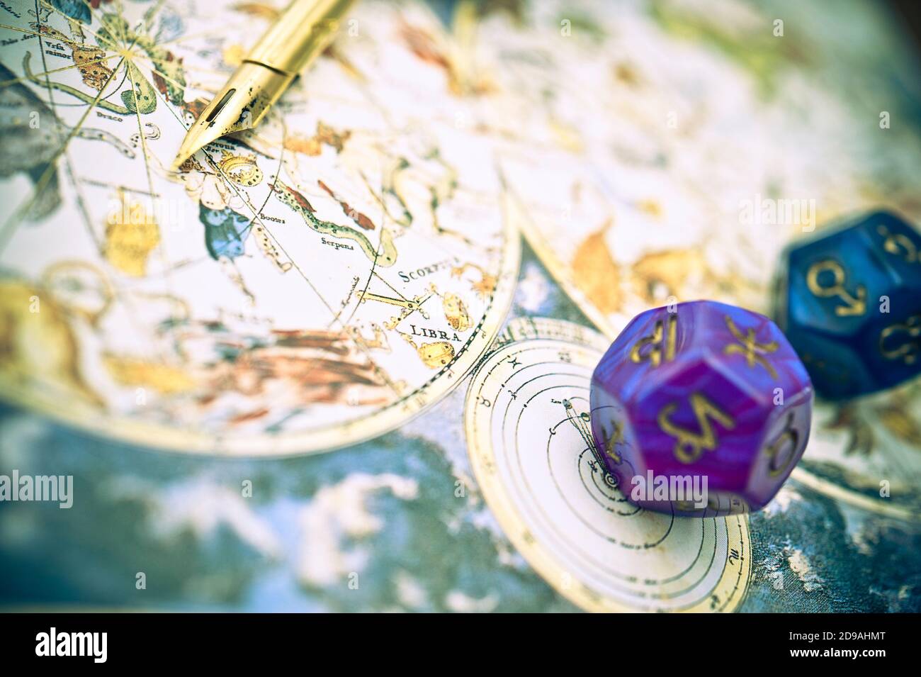 antique astrology chart with zodiac signs and dice with a quill pen ...