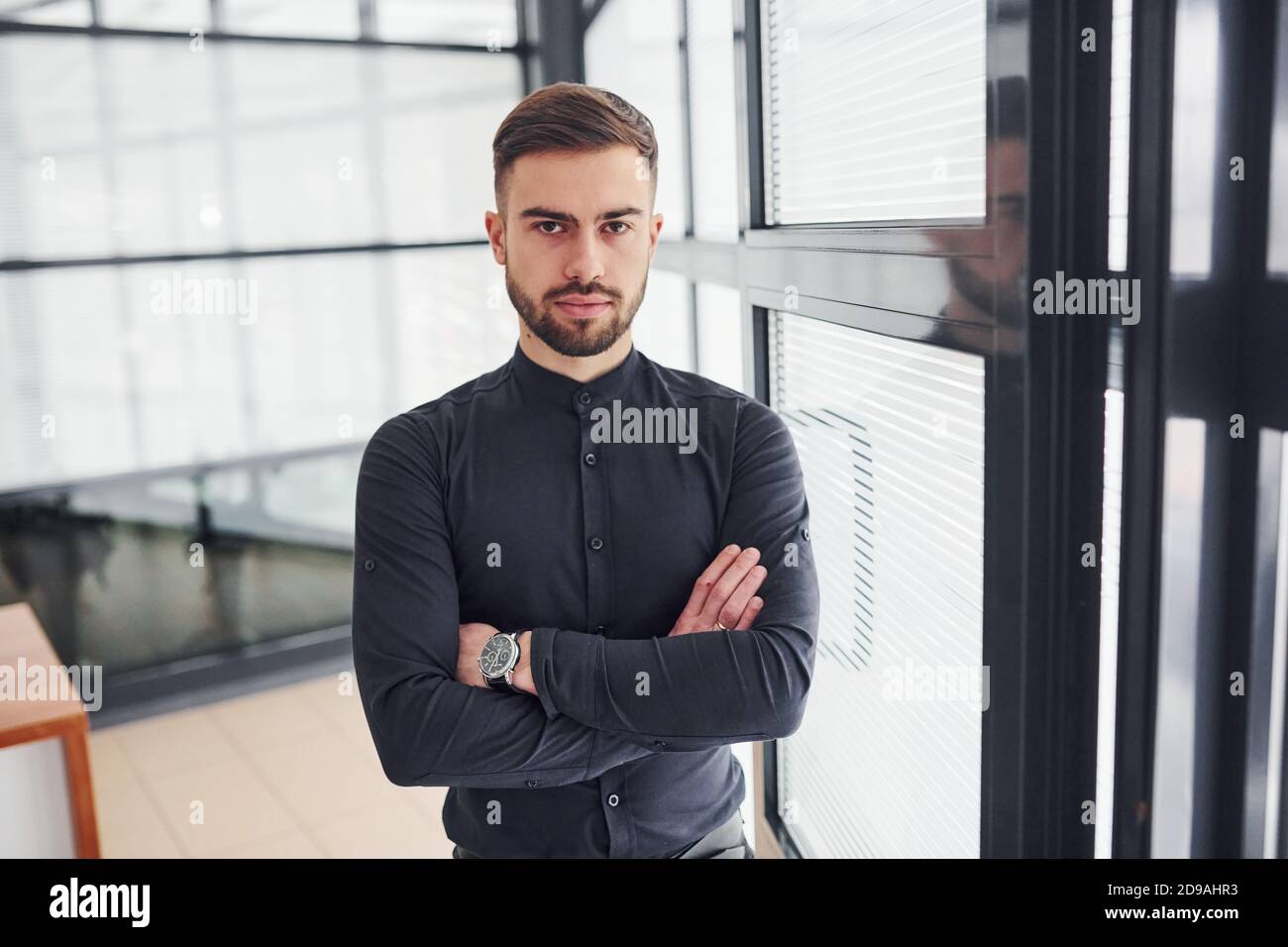 Office worker in formal clothes standing indoors at daytime Stock Photo ...