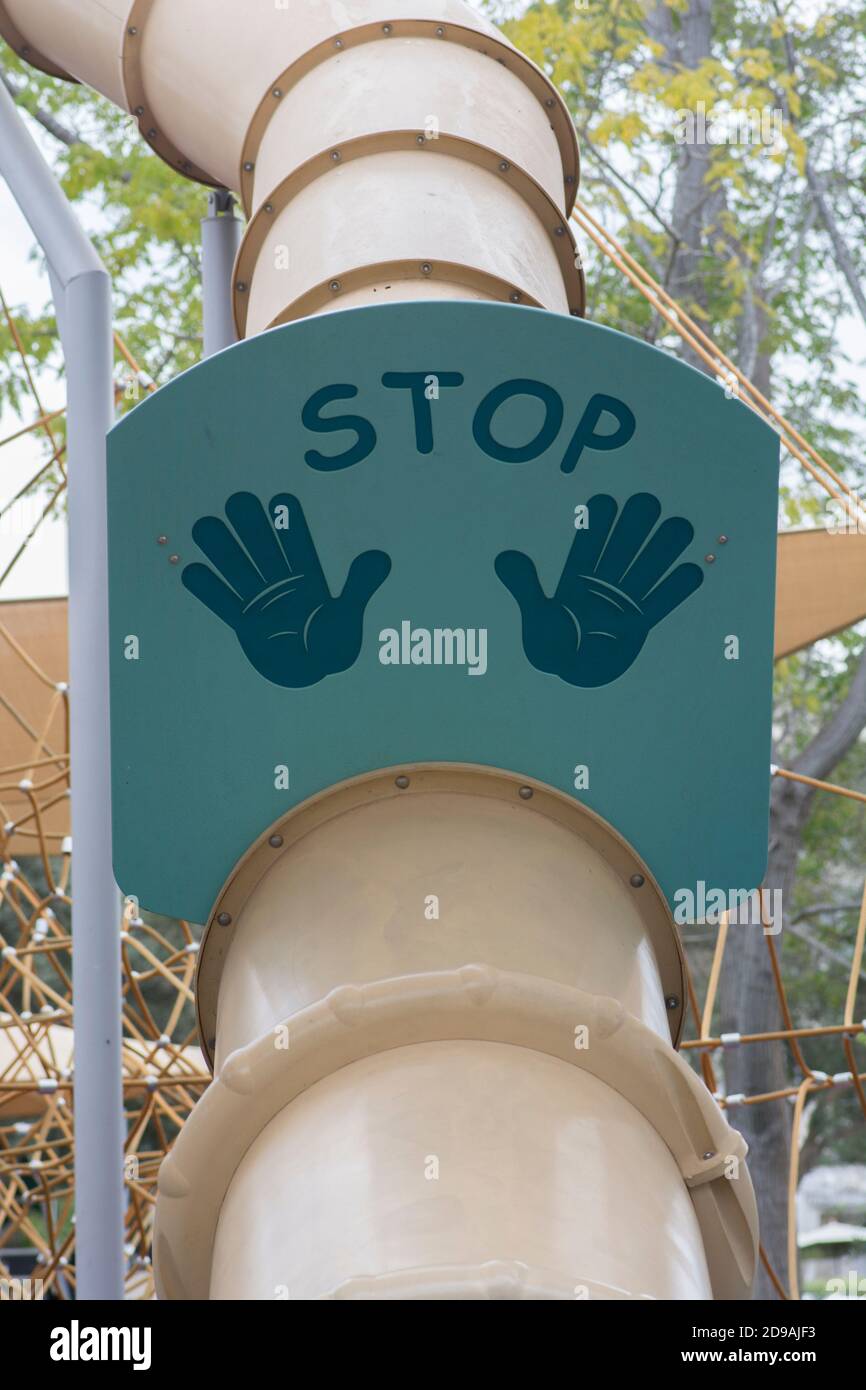 "Stop" sign in a playground, preventing kids from climbing the tube ...