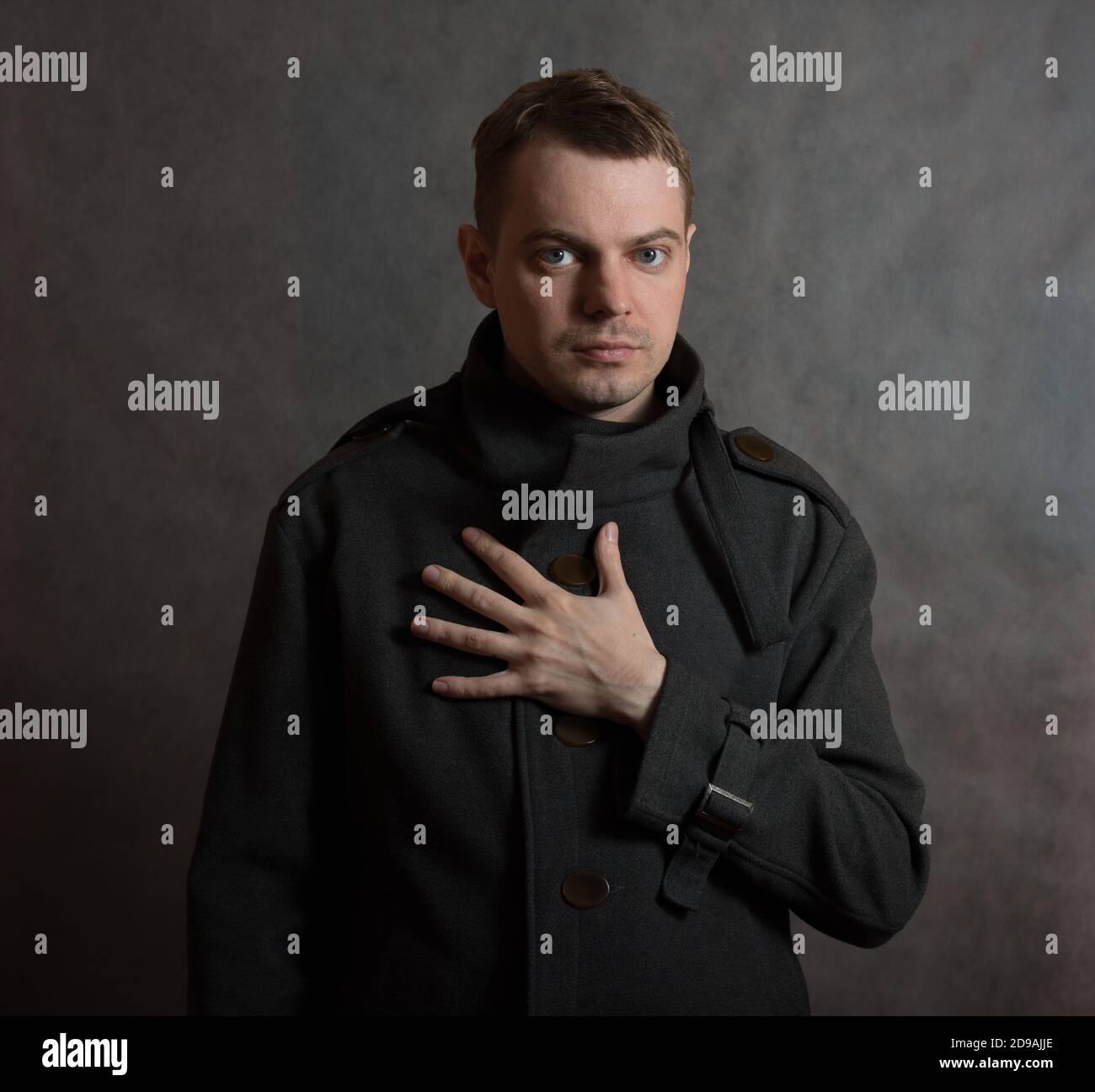 Young man in coat hi-res stock photography and images - Alamy