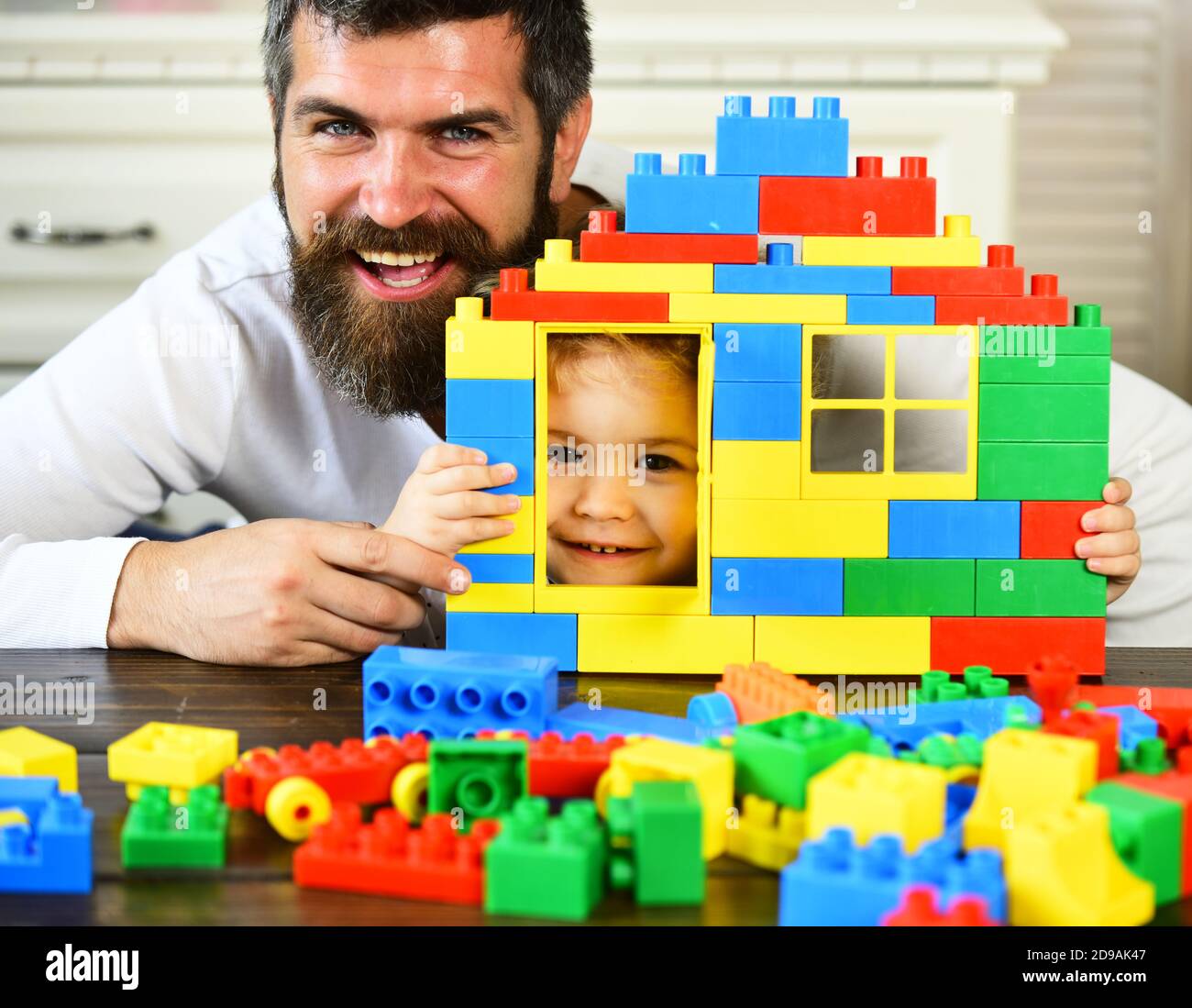 Boy and man on defocused background. Father and son with smiling faces ...
