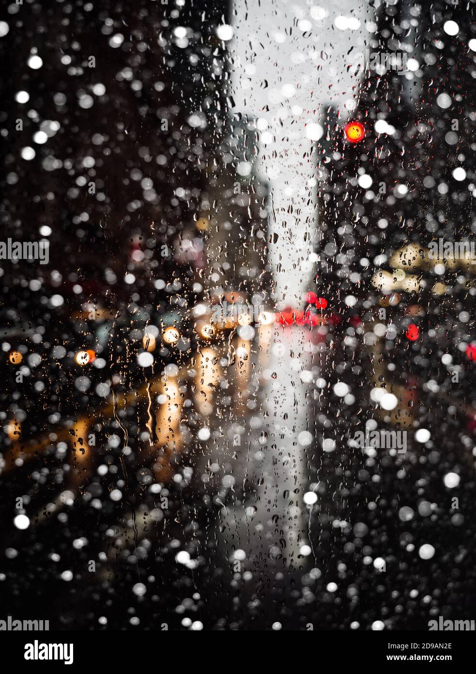 Blurred New York City street background with waterdrops, lights and ...