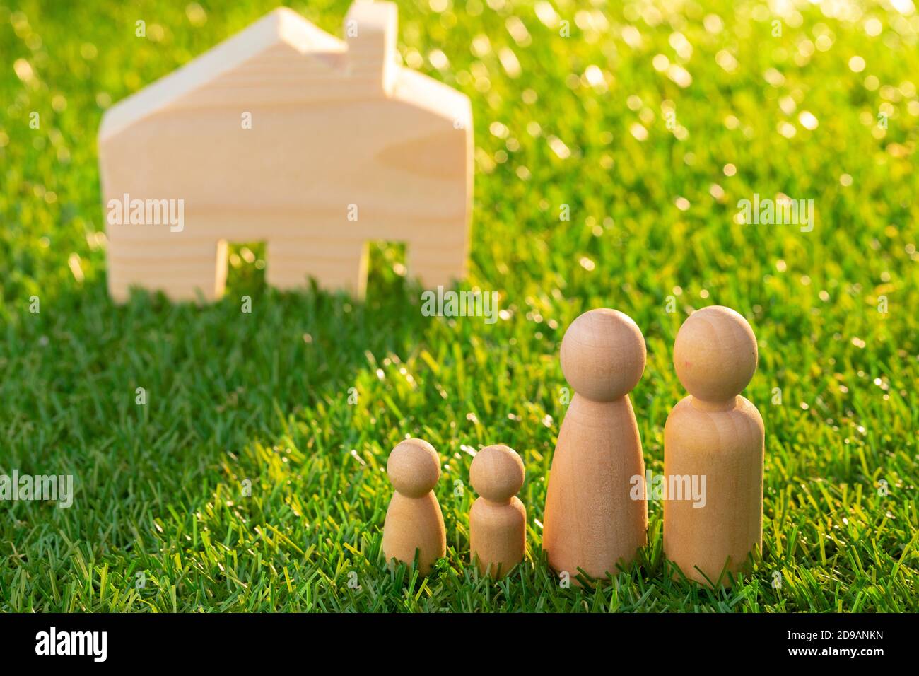 Wooden men figures and toy wooden house Stock Photo - Alamy