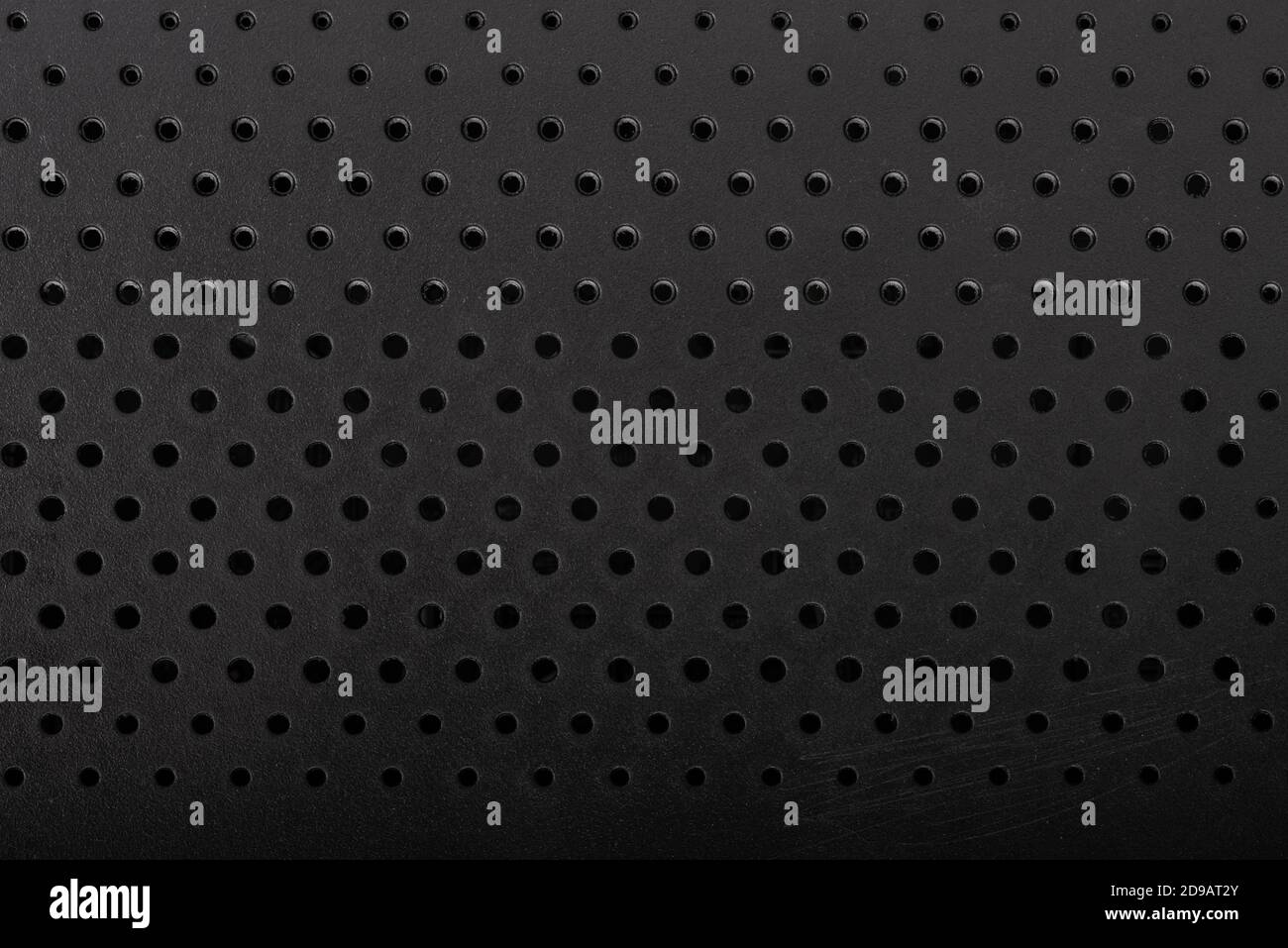 Black perforated plastic texture, surface with dots Stock Photo - Alamy