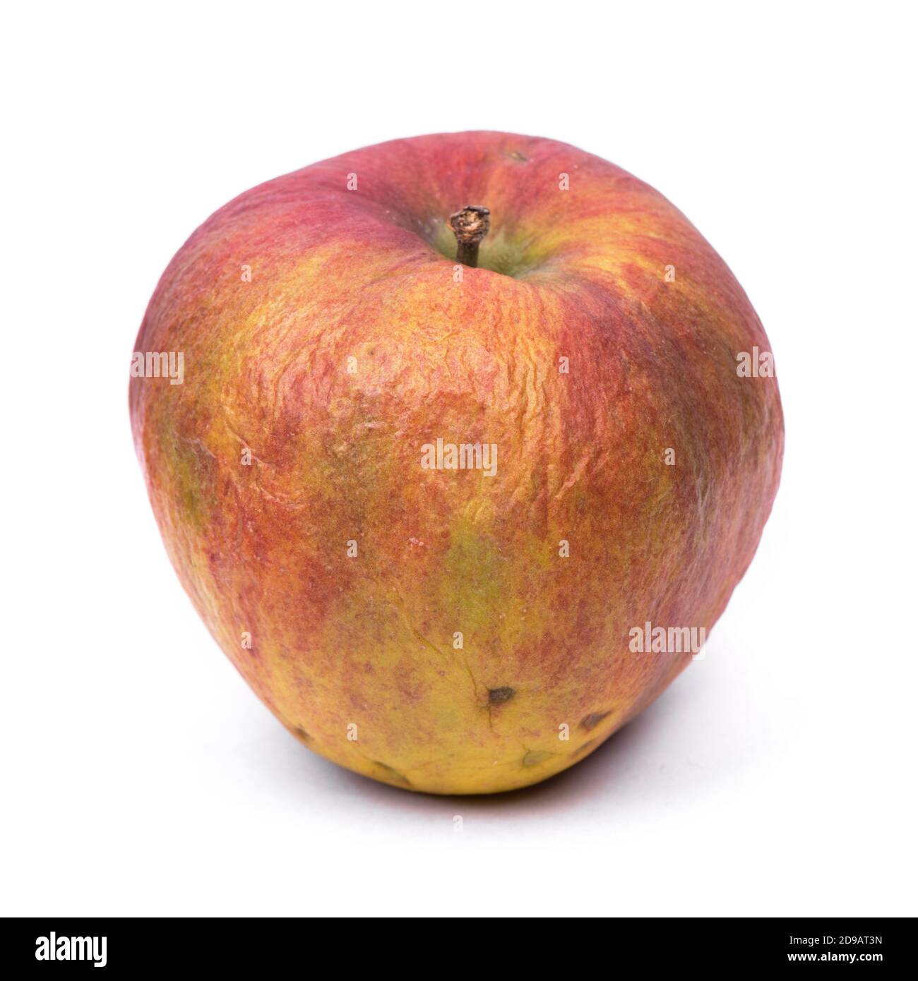 Old wrinkled apple isolated over white background Stock Photo - Alamy