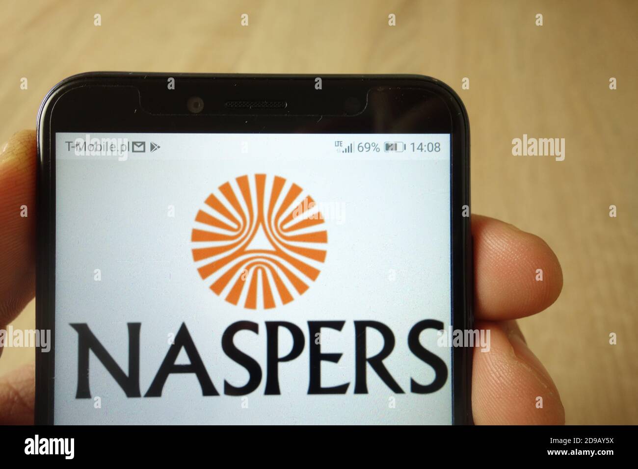 KONSKIE, POLAND - May 18, 2019: hand holding smartphone with Naspers ...