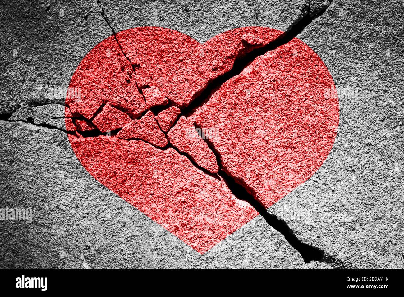 Red heart on a cracked texture. The concept of broken heart, end of ...