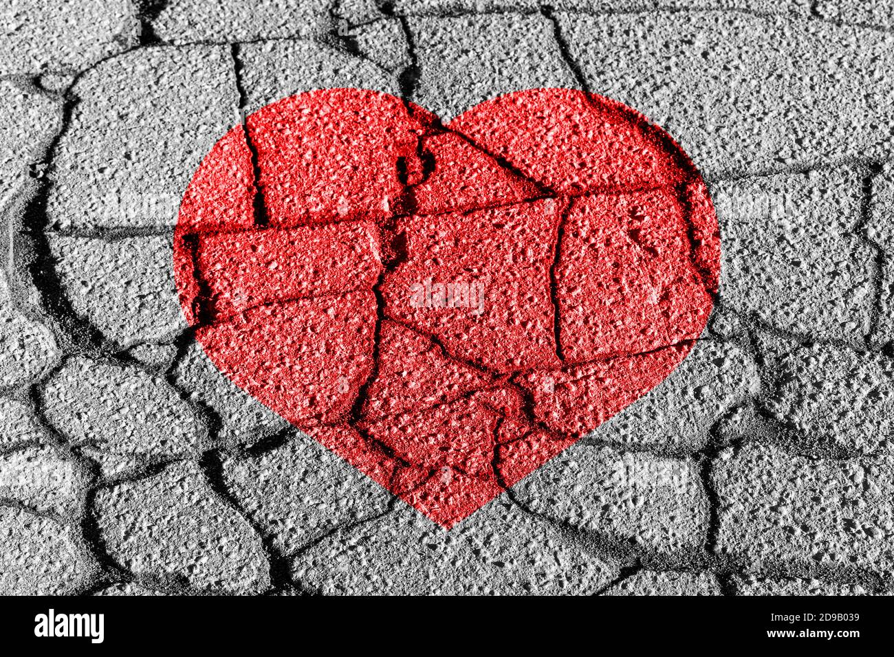 Red heart on a cracked texture. The concept of broken heart, end of ...