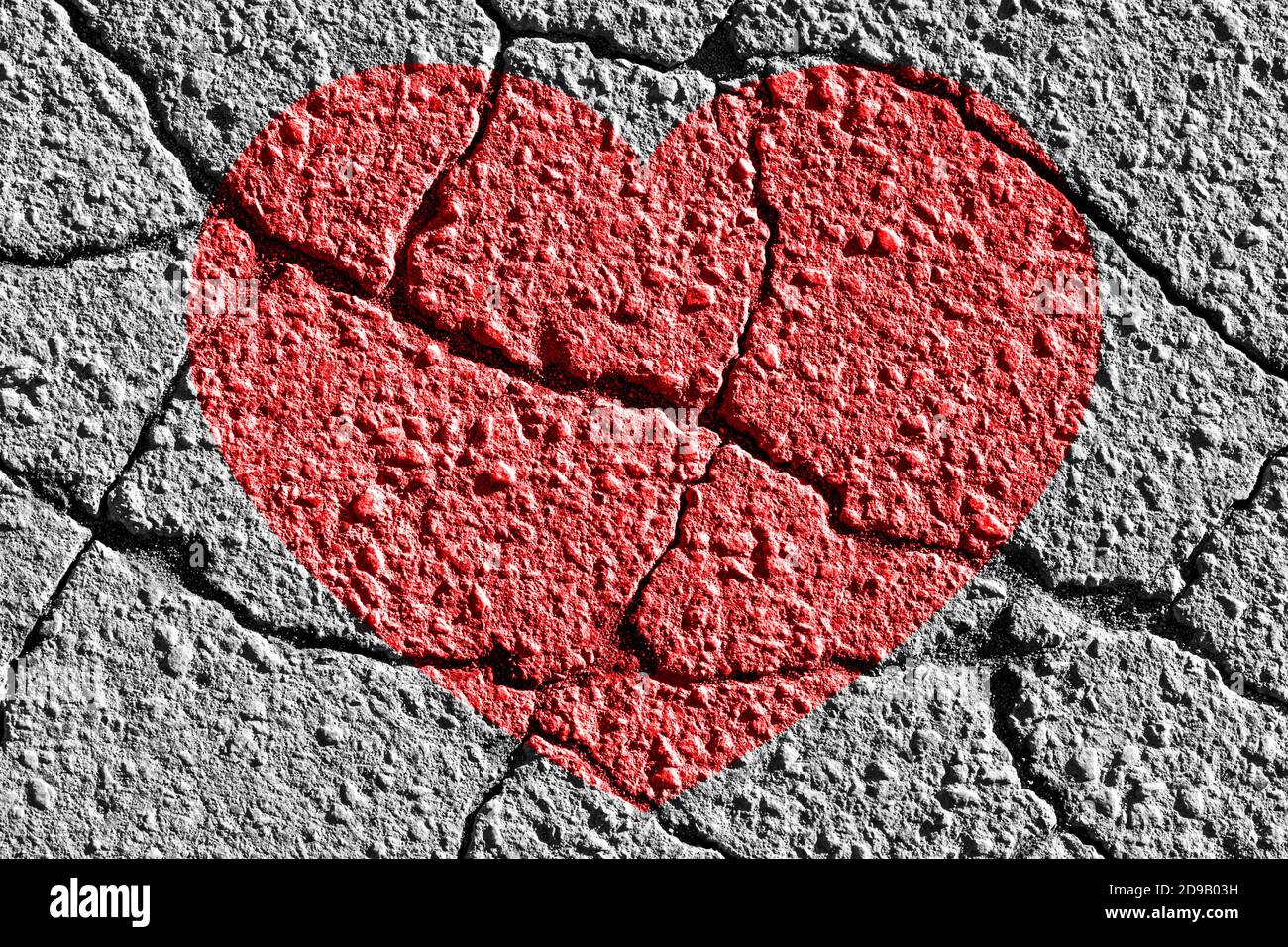 Red heart on a cracked texture. The concept of broken heart, end of ...